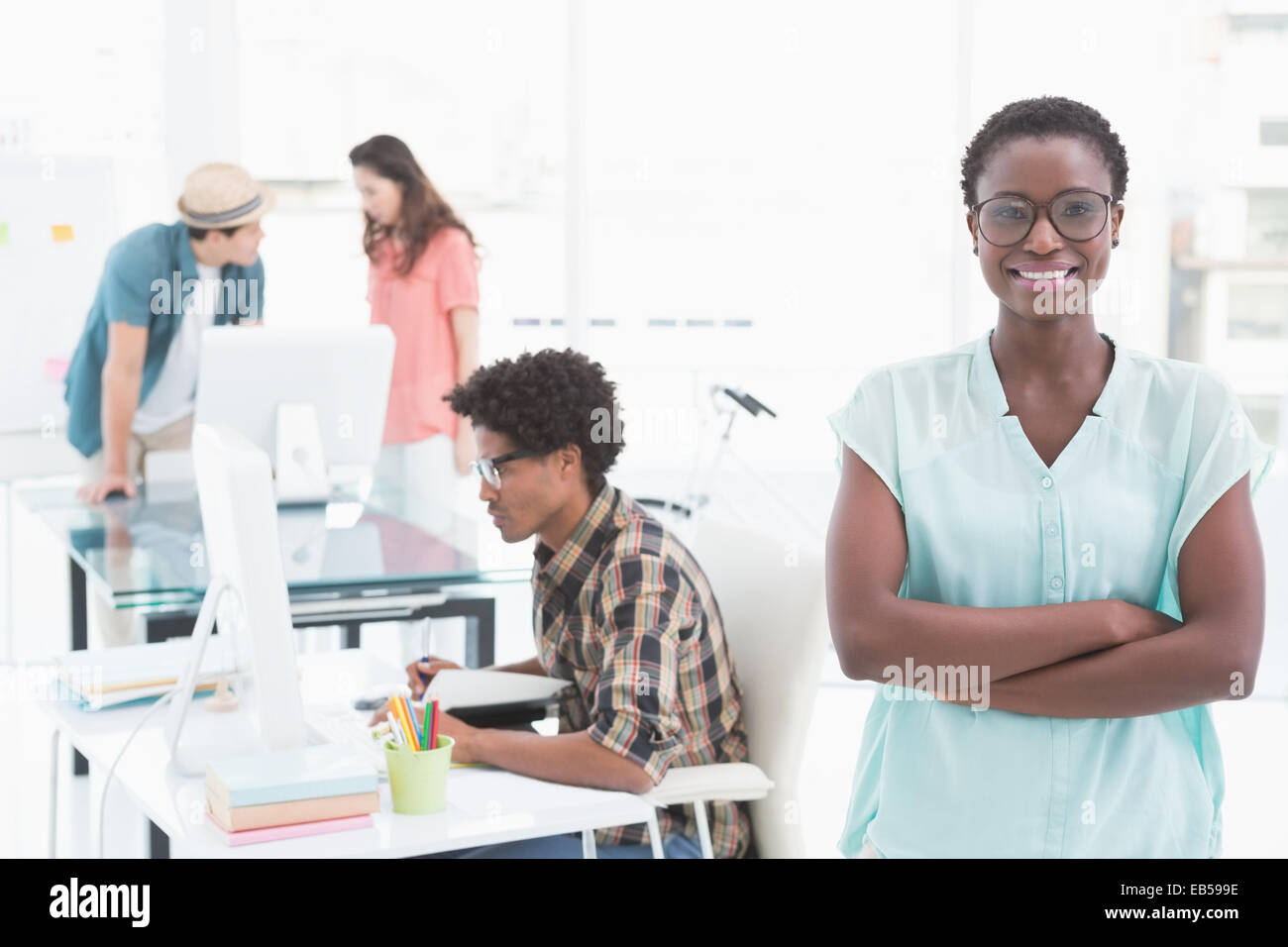 Young creative woman smiling at camera Stock Photo - Alamy