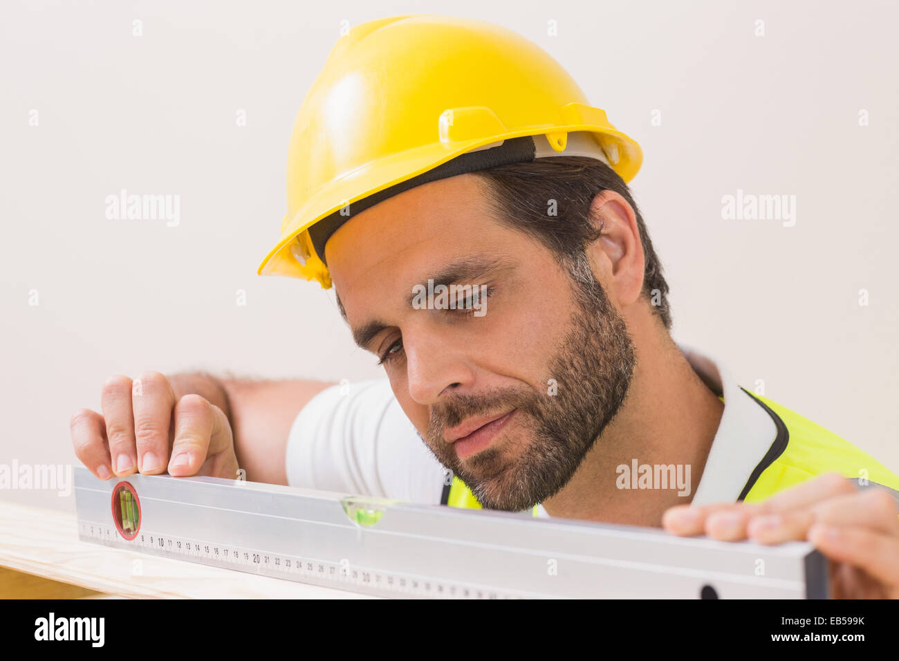 Construction worker using spirit level hi-res stock photography and ...