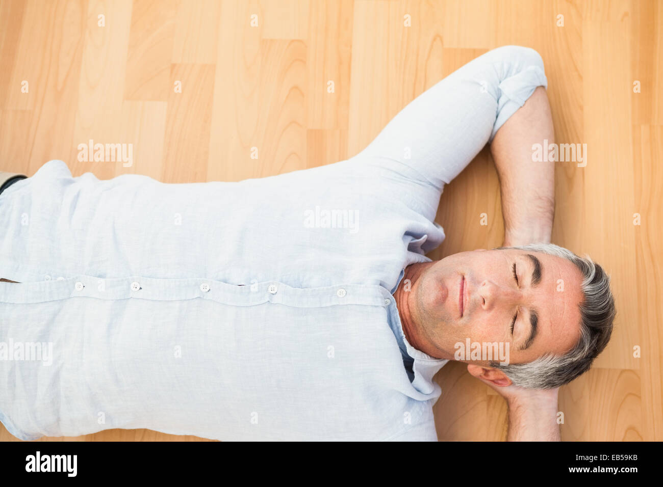 Man lying and relaxing on the floor Stock Photo - Alamy