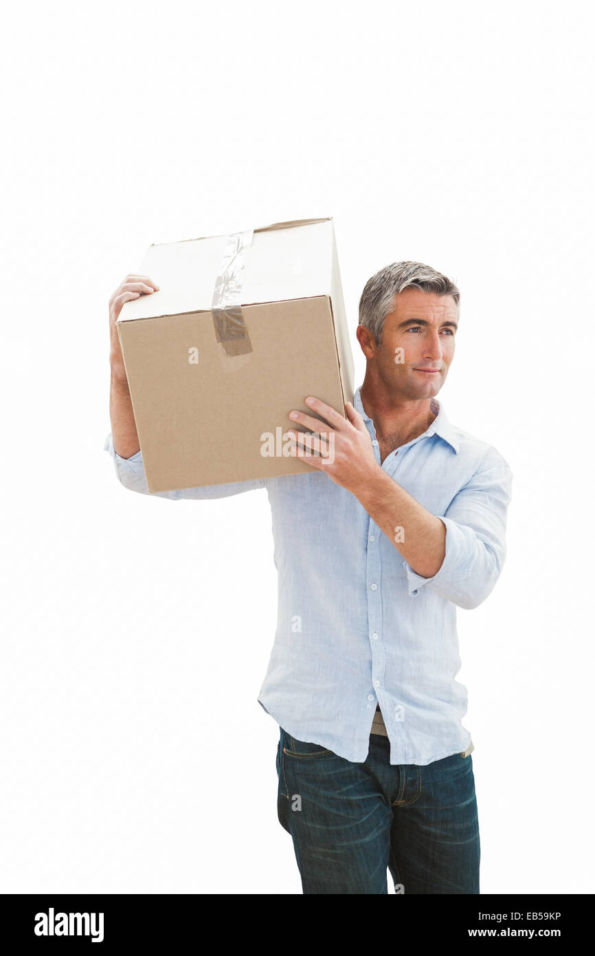 Smiling man carrying cardboard box Stock Photo - Alamy
