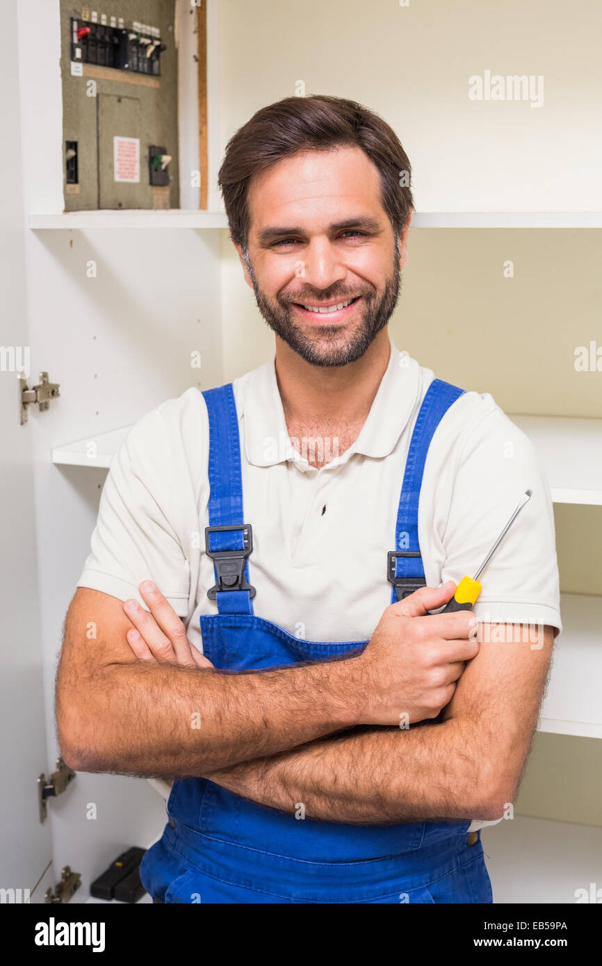 Handyman smiling at the camera Stock Photo - Alamy