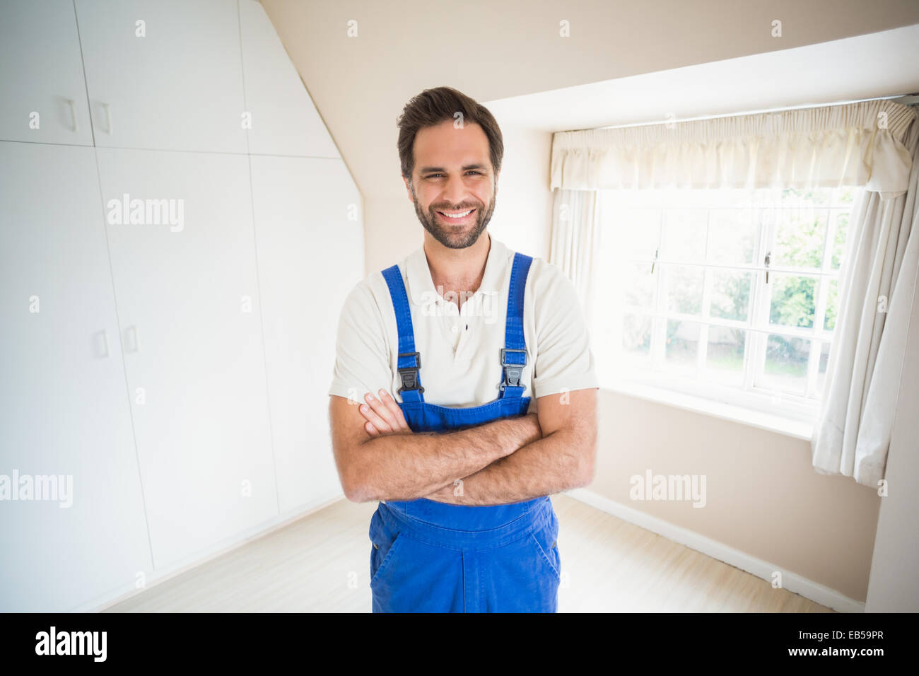 Handyman smiling at camera Stock Photo - Alamy