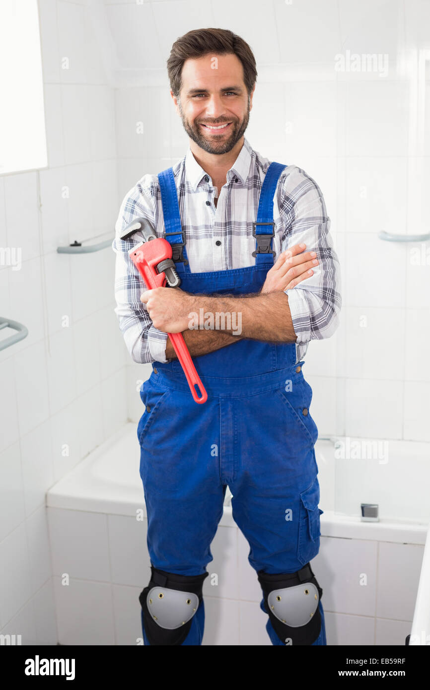 Plumber smiling at the camera Stock Photo - Alamy