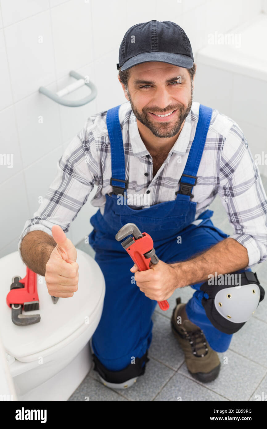 Plumber smiling at the camera Stock Photo - Alamy
