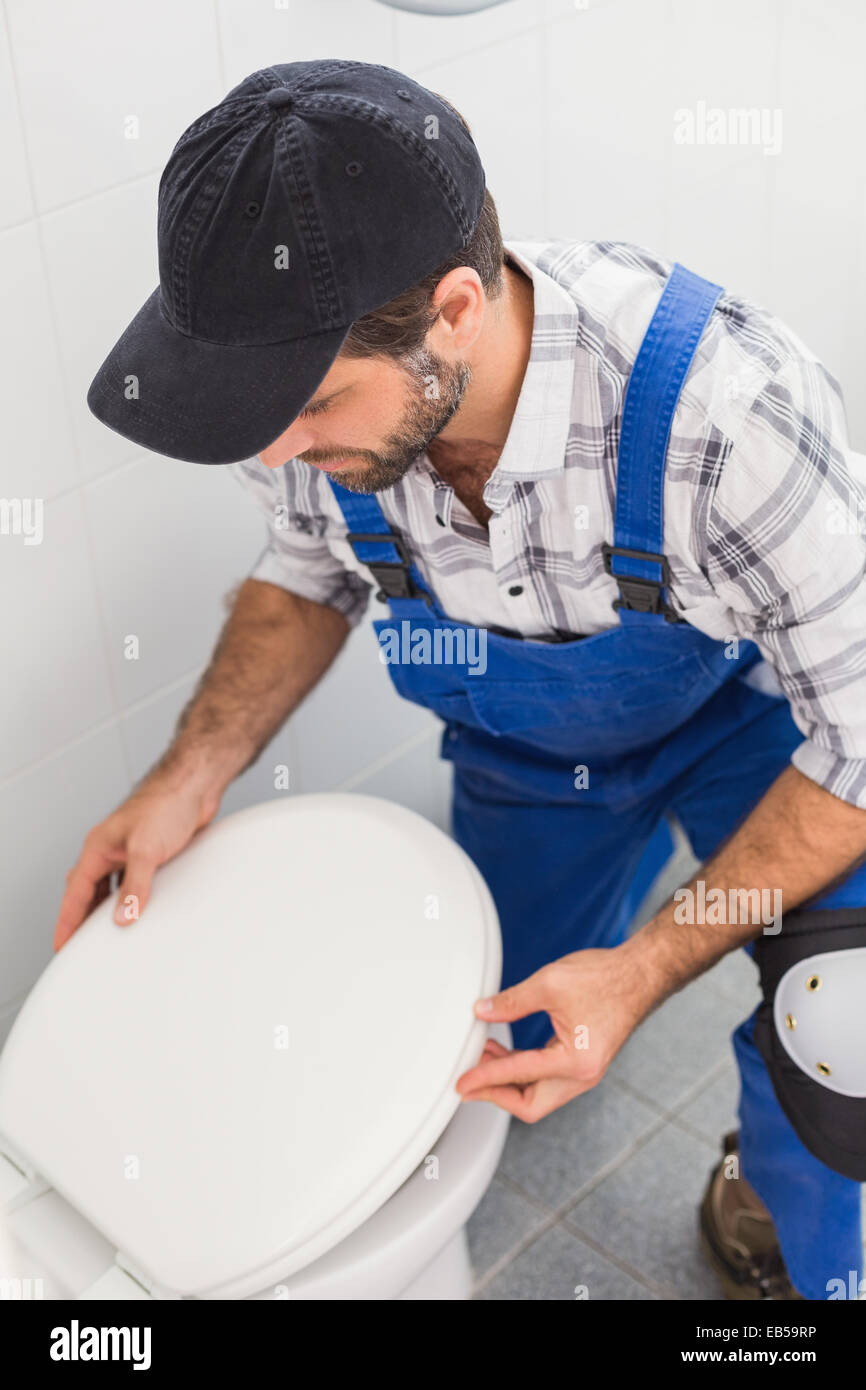 Professional plumber working toilet hi-res stock photography and images ...