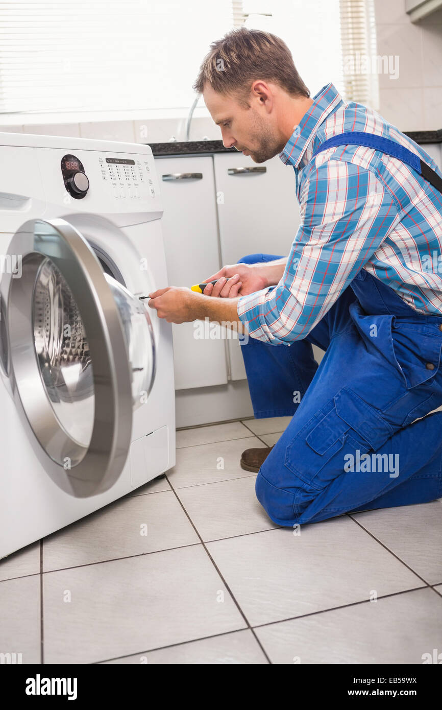 Fixing washing machine hi-res stock photography and images - Alamy