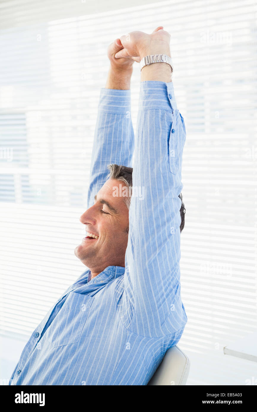 Relaxed businessman stretching arms hi-res stock photography and images ...