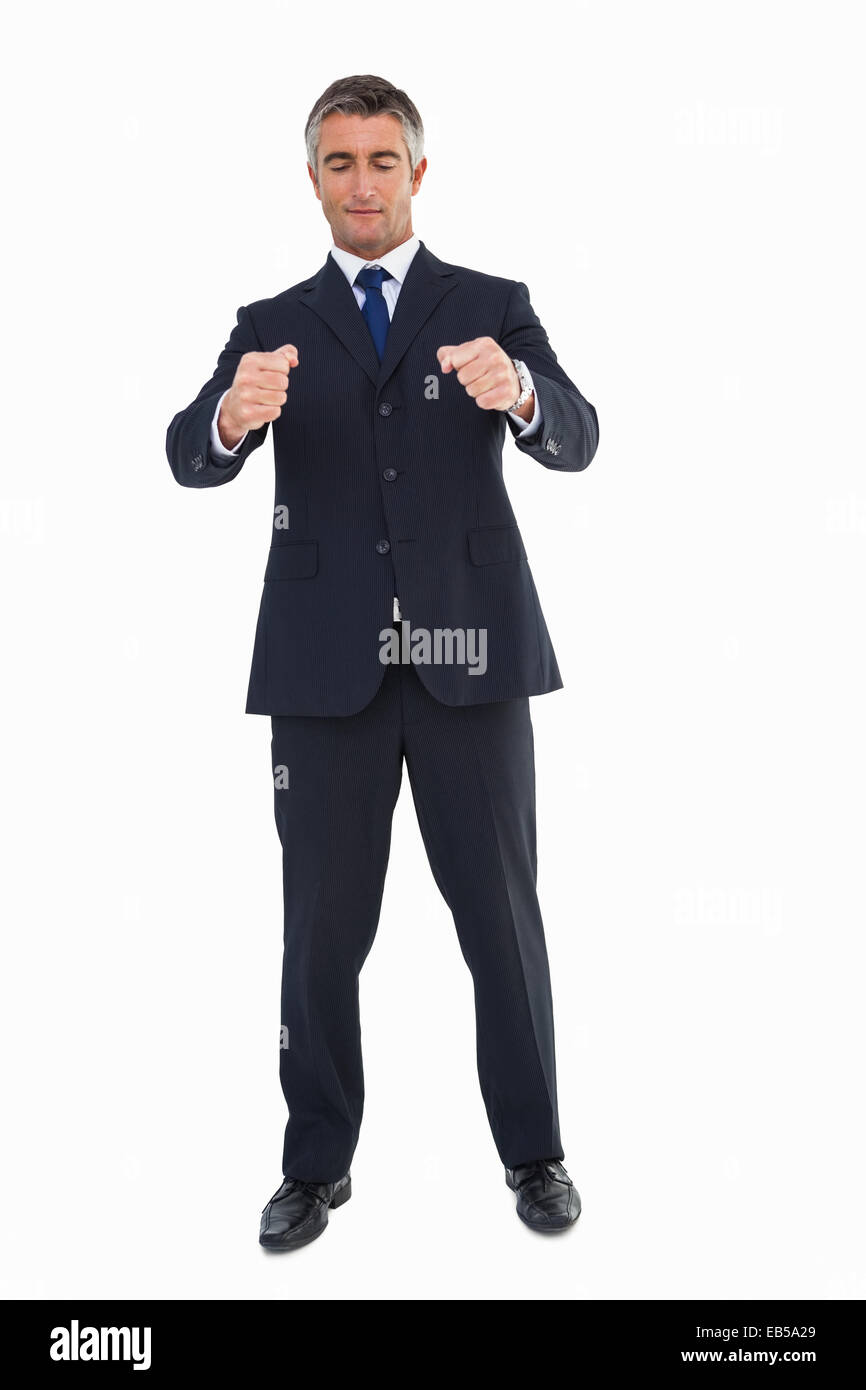 Businessman with eyes closed and open arms Stock Photo - Alamy