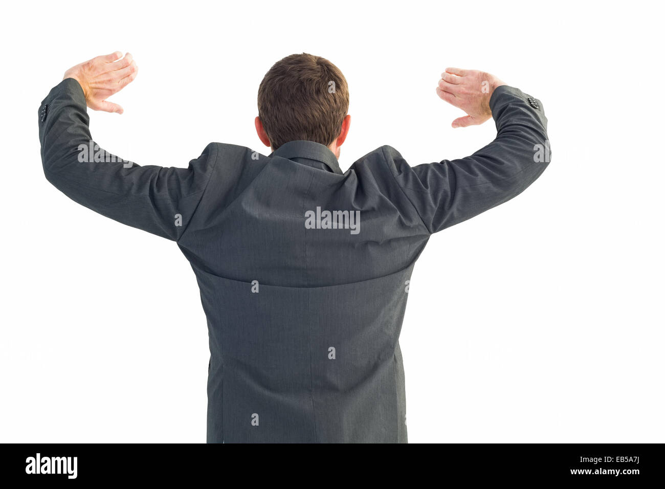 Businessman standing with hands up Stock Photo - Alamy