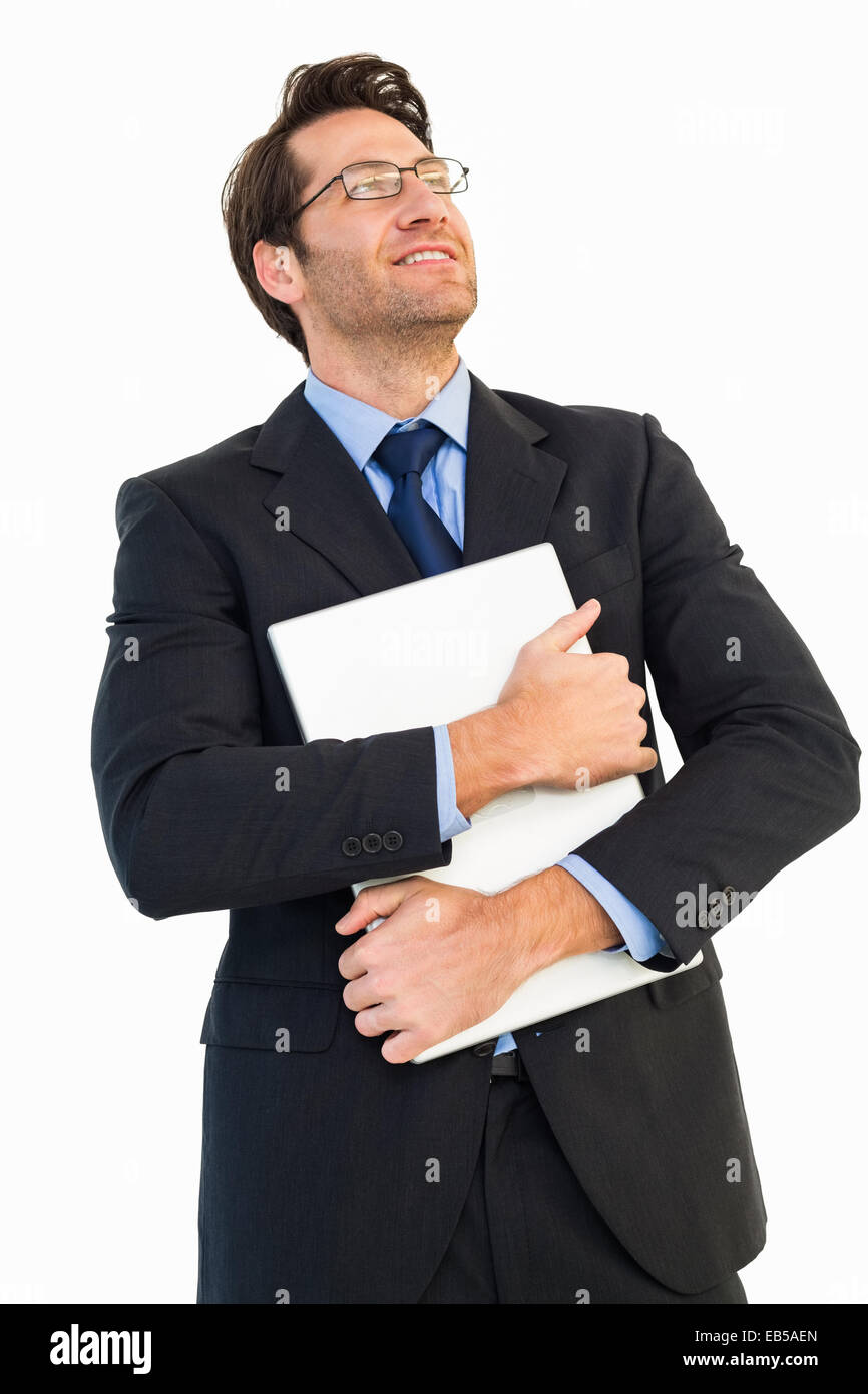 Handsome businessman holding his laptop Stock Photo - Alamy