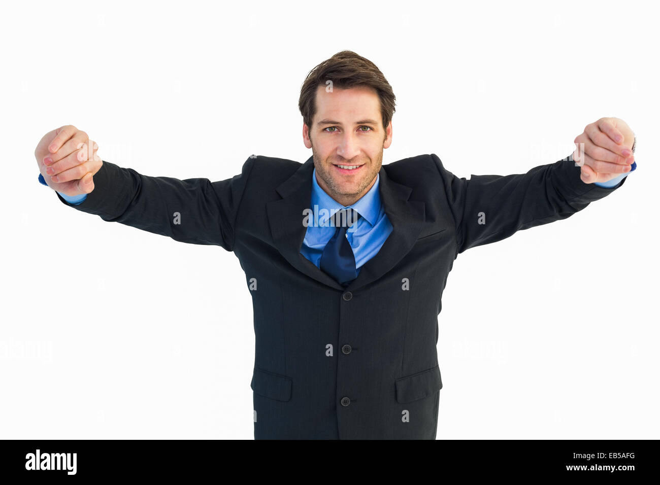 Businessman standing with arms out Stock Photo - Alamy