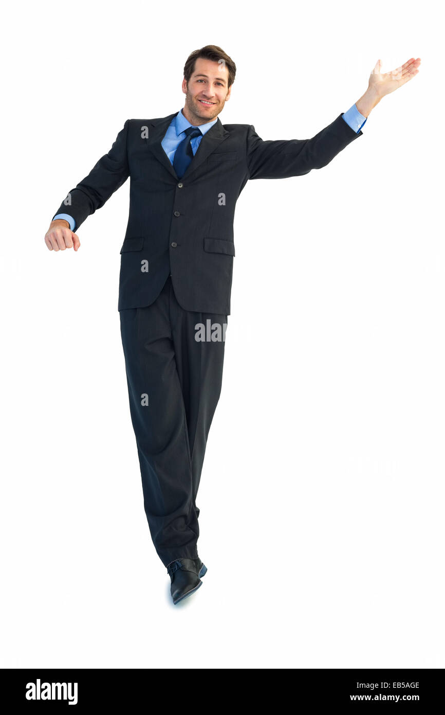 Happy businessman well dressed with arms out Stock Photo - Alamy