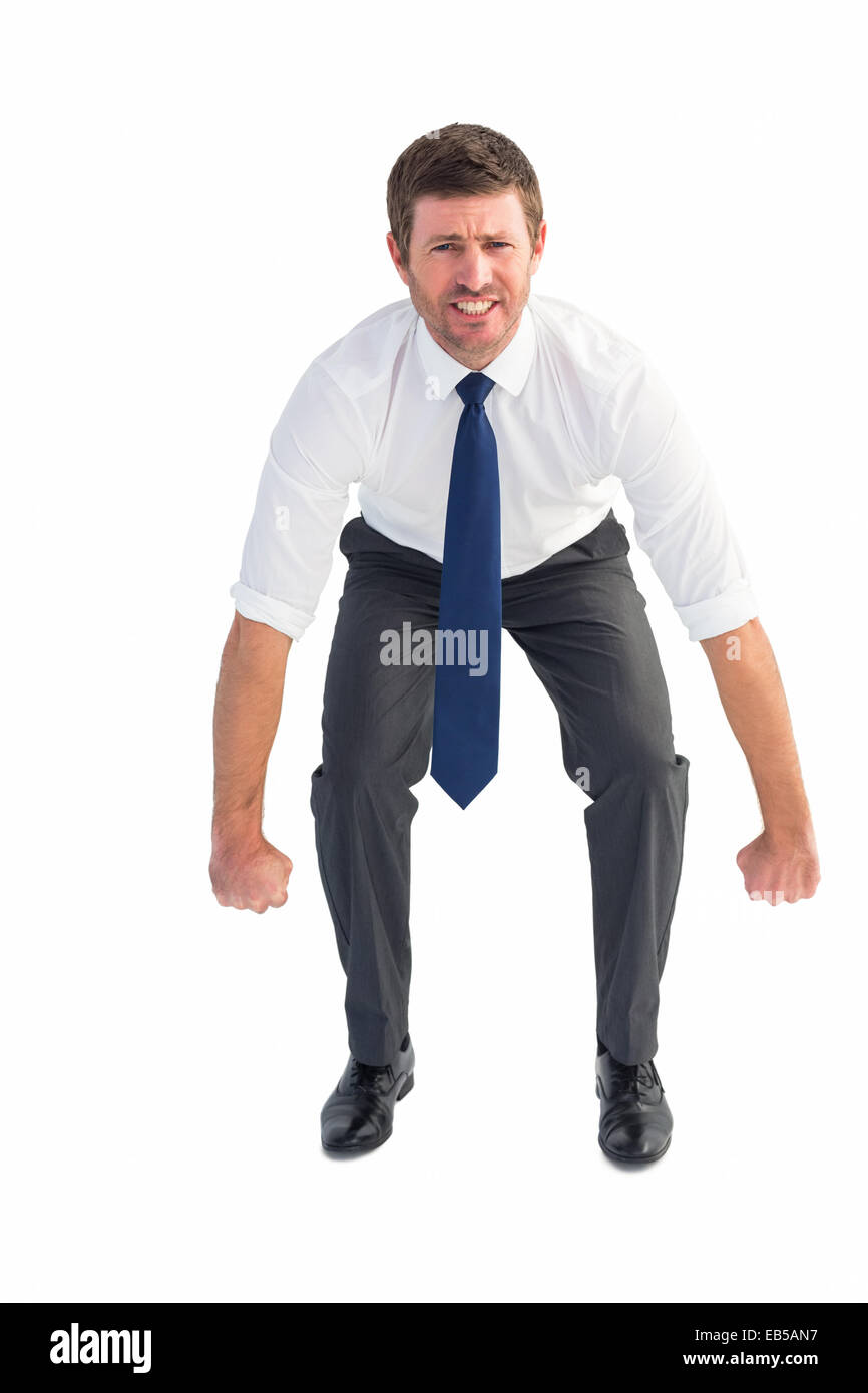 Businessman bending and lifting Stock Photo - Alamy