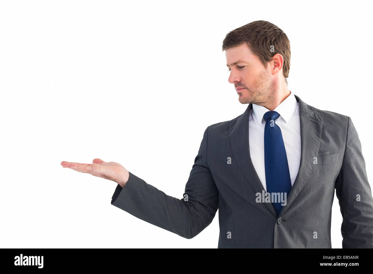 Businessman with his hand out Stock Photo - Alamy