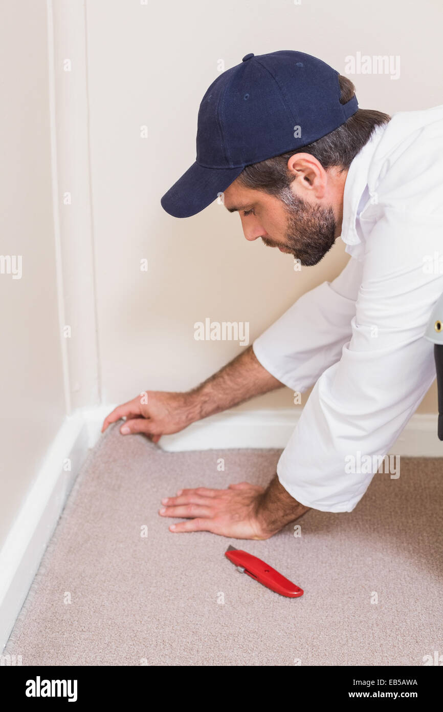 Handyman laying down carpet hi-res stock photography and images - Alamy