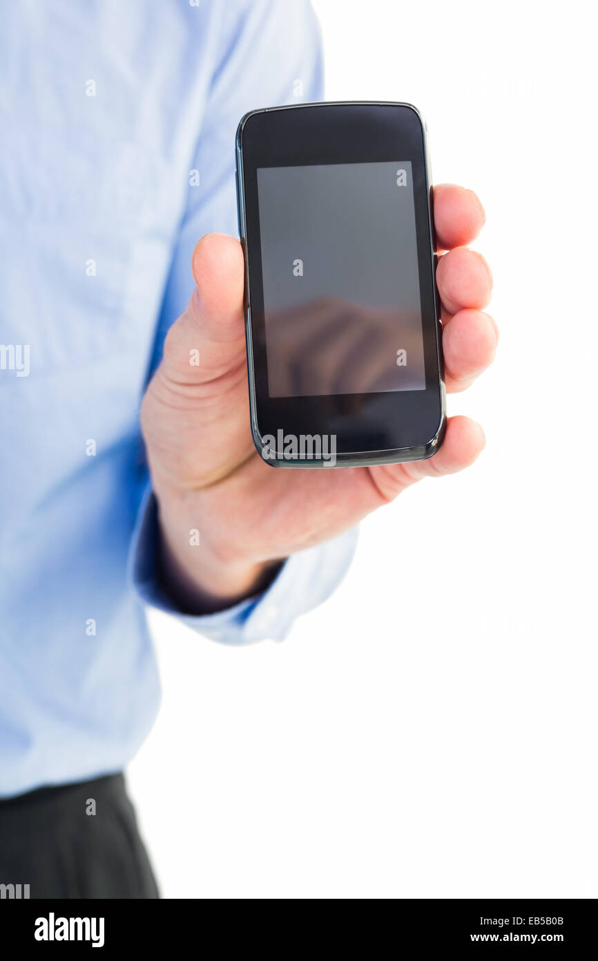 Businessman showing his smartphone to camera Stock Photo - Alamy