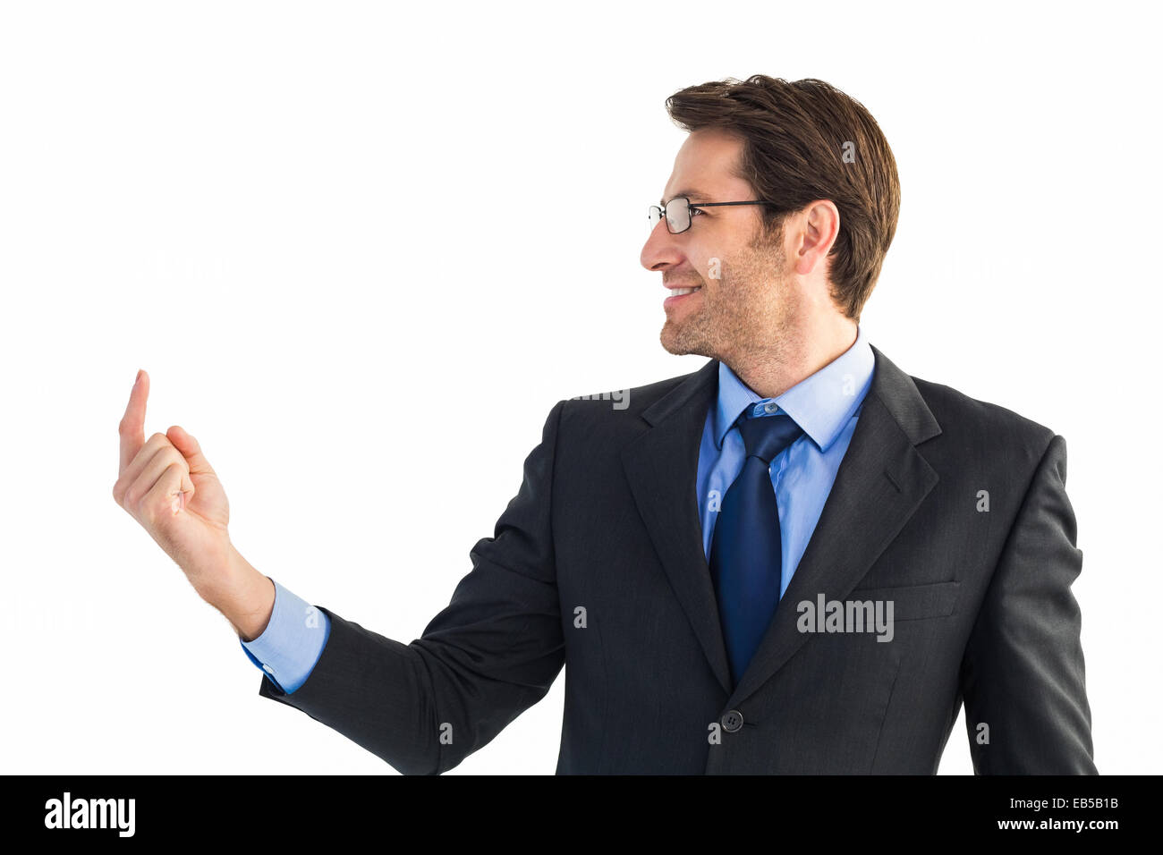 Smiling businessman pointing at a copy space Stock Photo - Alamy