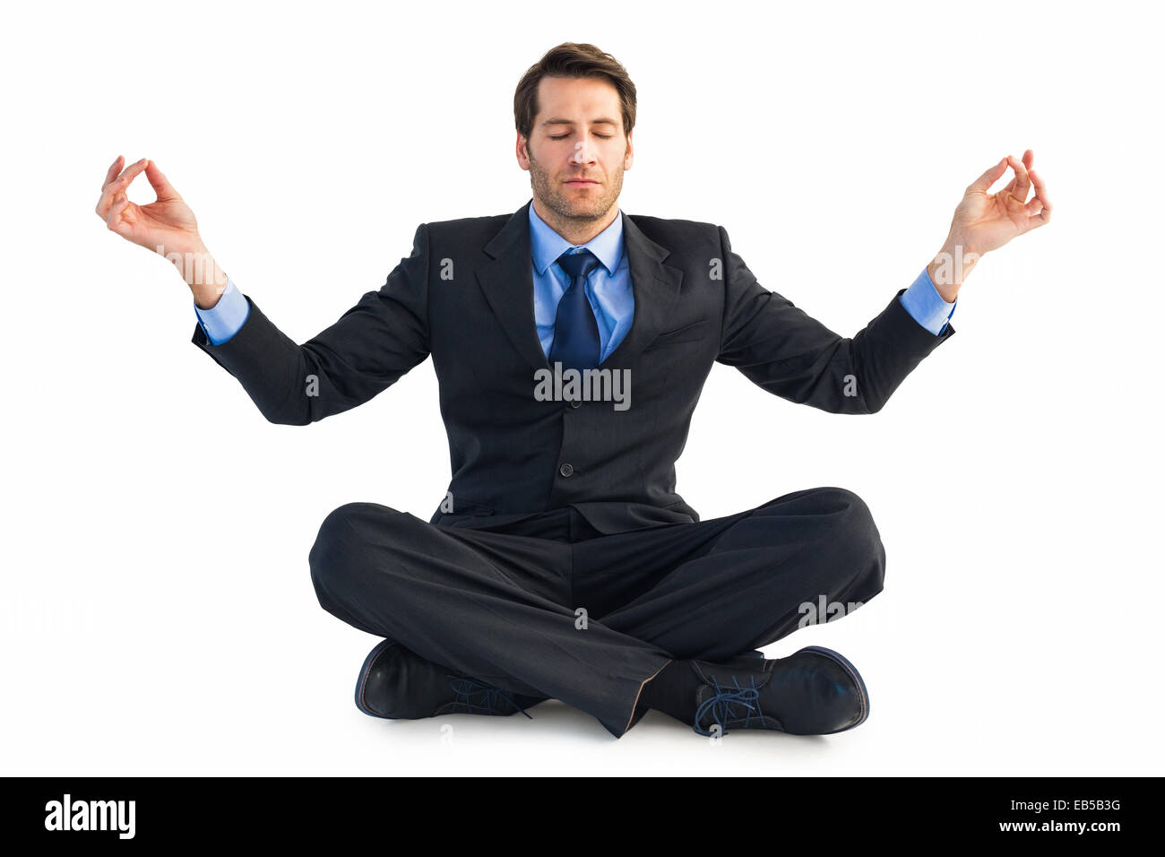 Calm businessman sitting in lotus pose Stock Photo - Alamy