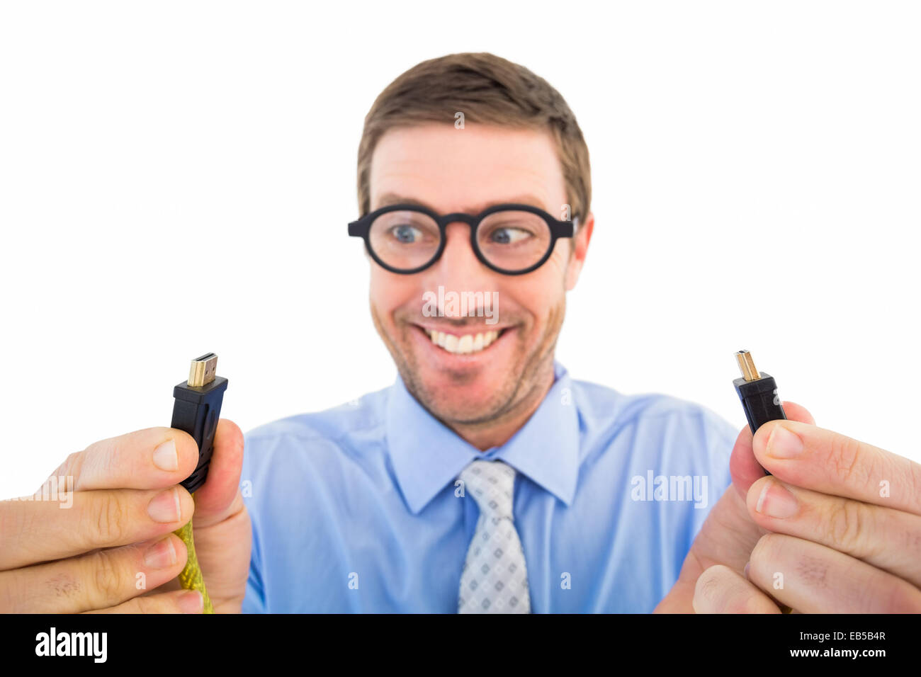 Geeky businessman holding two cables Stock Photo - Alamy