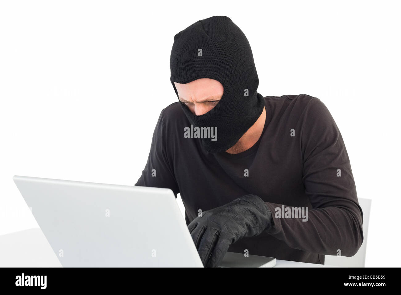 Hacker using laptop to steal identity Stock Photo - Alamy