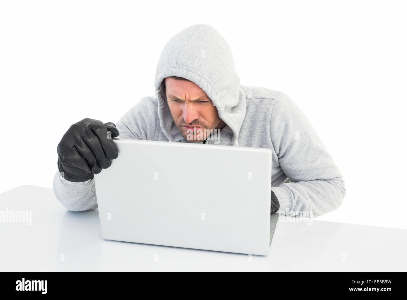 Hacker using laptop to steal identity Stock Photo - Alamy