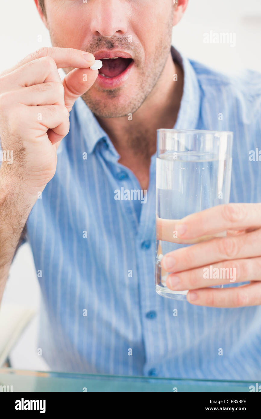 Casual businessman taking a tablet Stock Photo - Alamy
