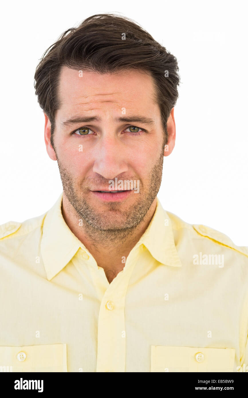Handsome young man looking confused Stock Photo - Alamy