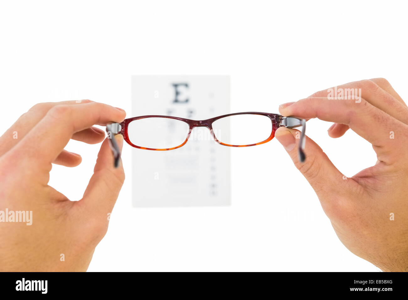 Hands holding glasses eye test hi-res stock photography and images - Alamy