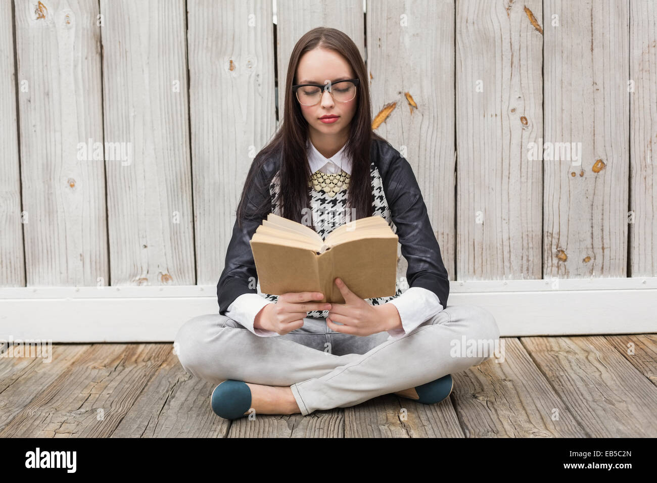 Pretty hipster reading a book Stock Photo - Alamy
