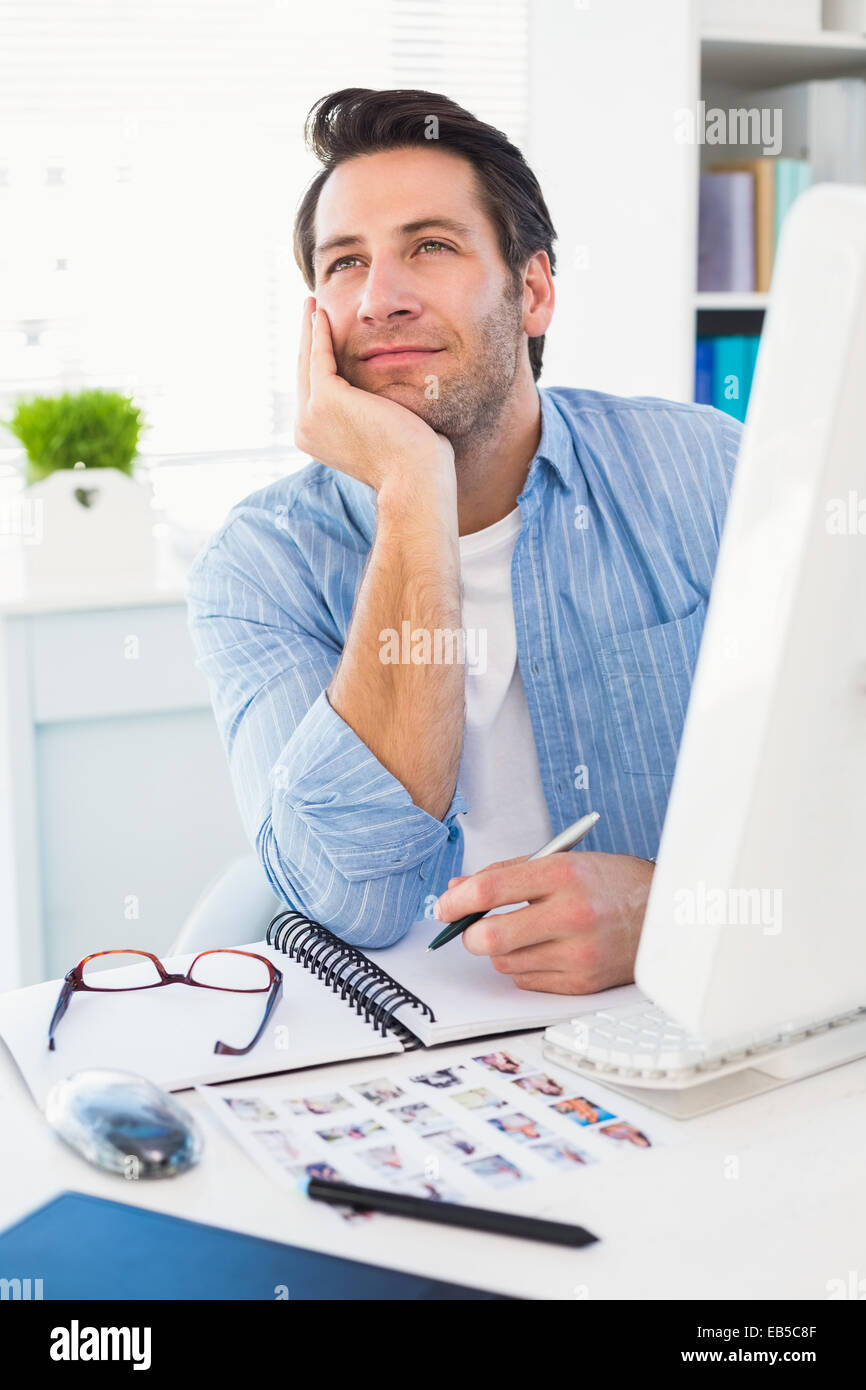 Man thinking writing on notepad hi-res stock photography and images - Alamy