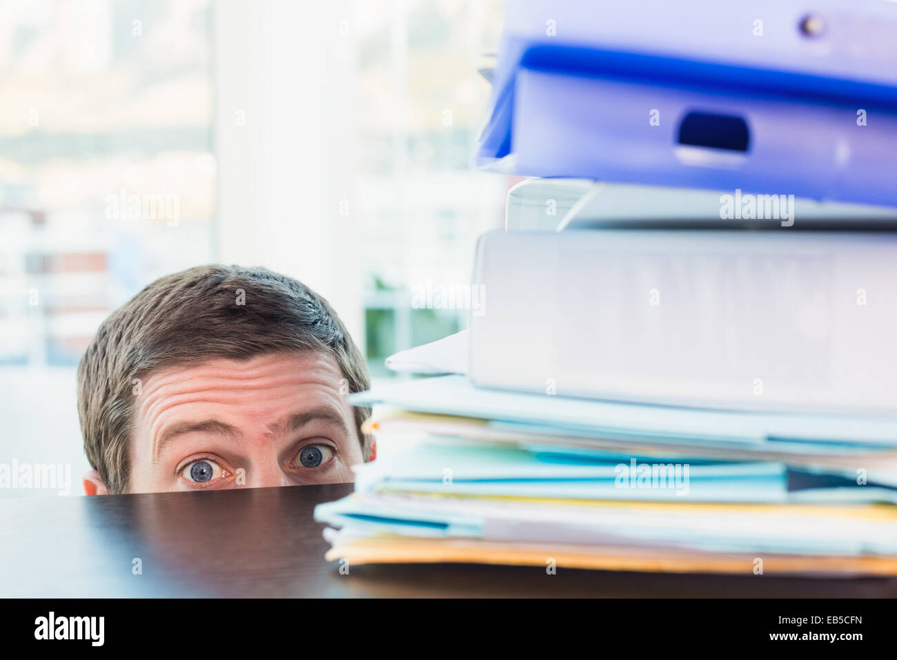 Peeking over desk hi-res stock photography and images - Alamy