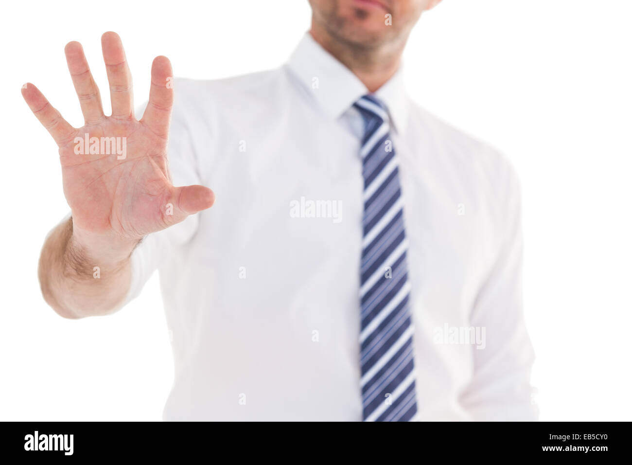Handsome businessman gesturing with hand Stock Photo - Alamy
