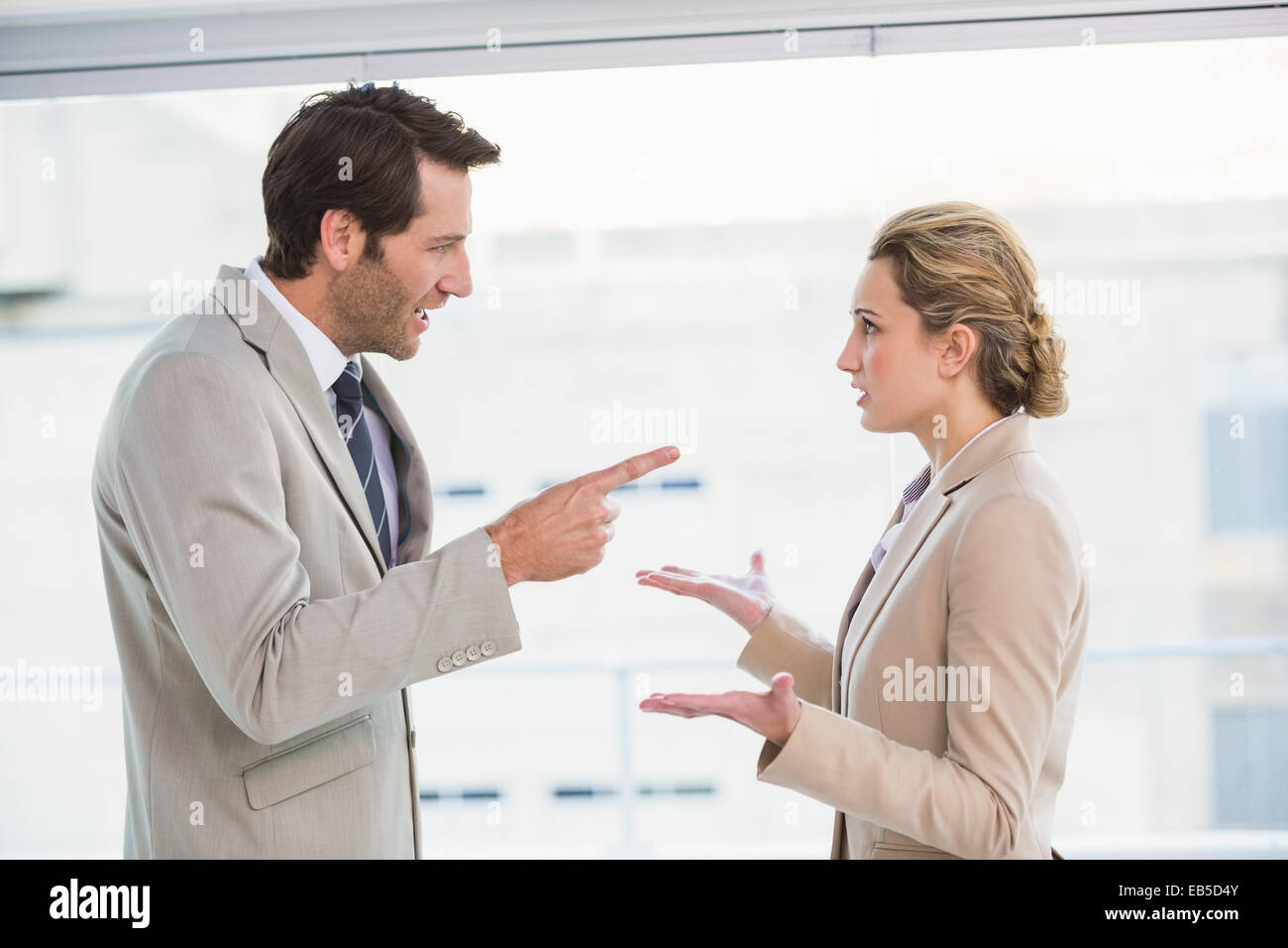 Angry man pointing at his colleague Stock Photo - Alamy