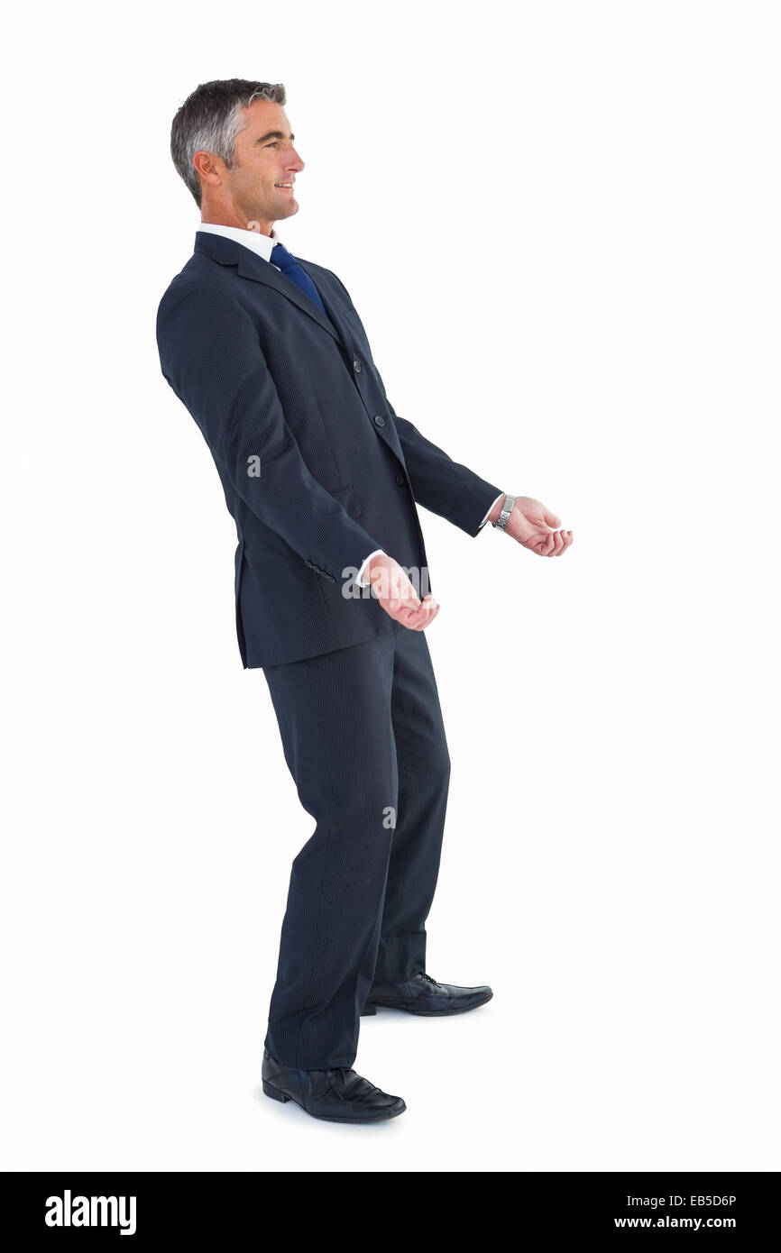 Cheerful businessman posing with arms out Stock Photo - Alamy