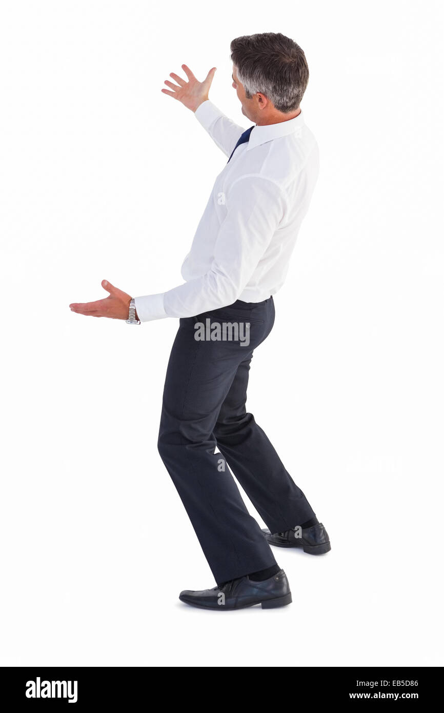 Businessman without his jacket posing with arms out Stock Photo - Alamy