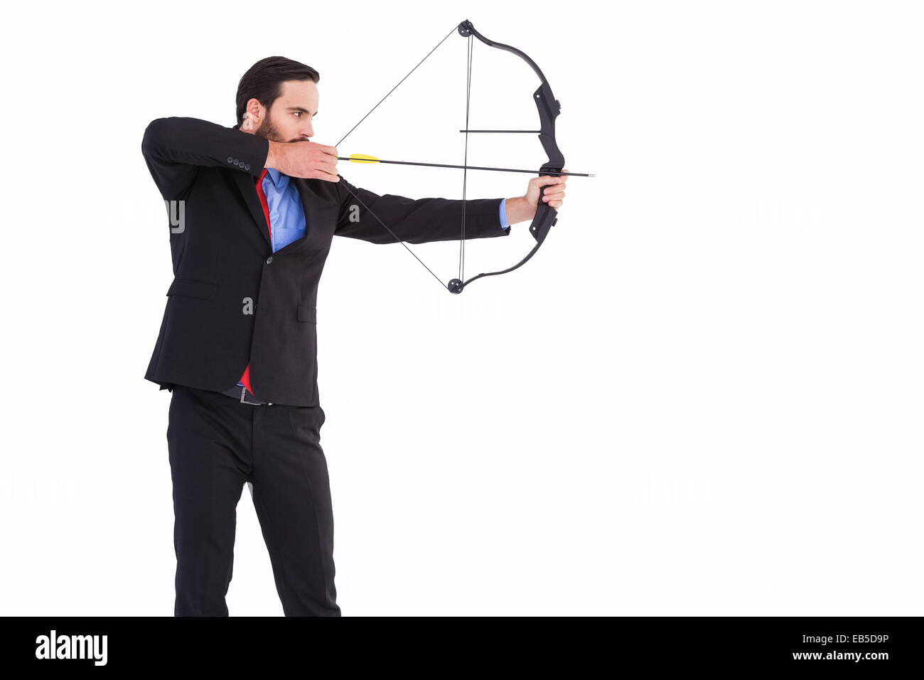 Focused businessman shooting a bow and arrow Stock Photo - Alamy