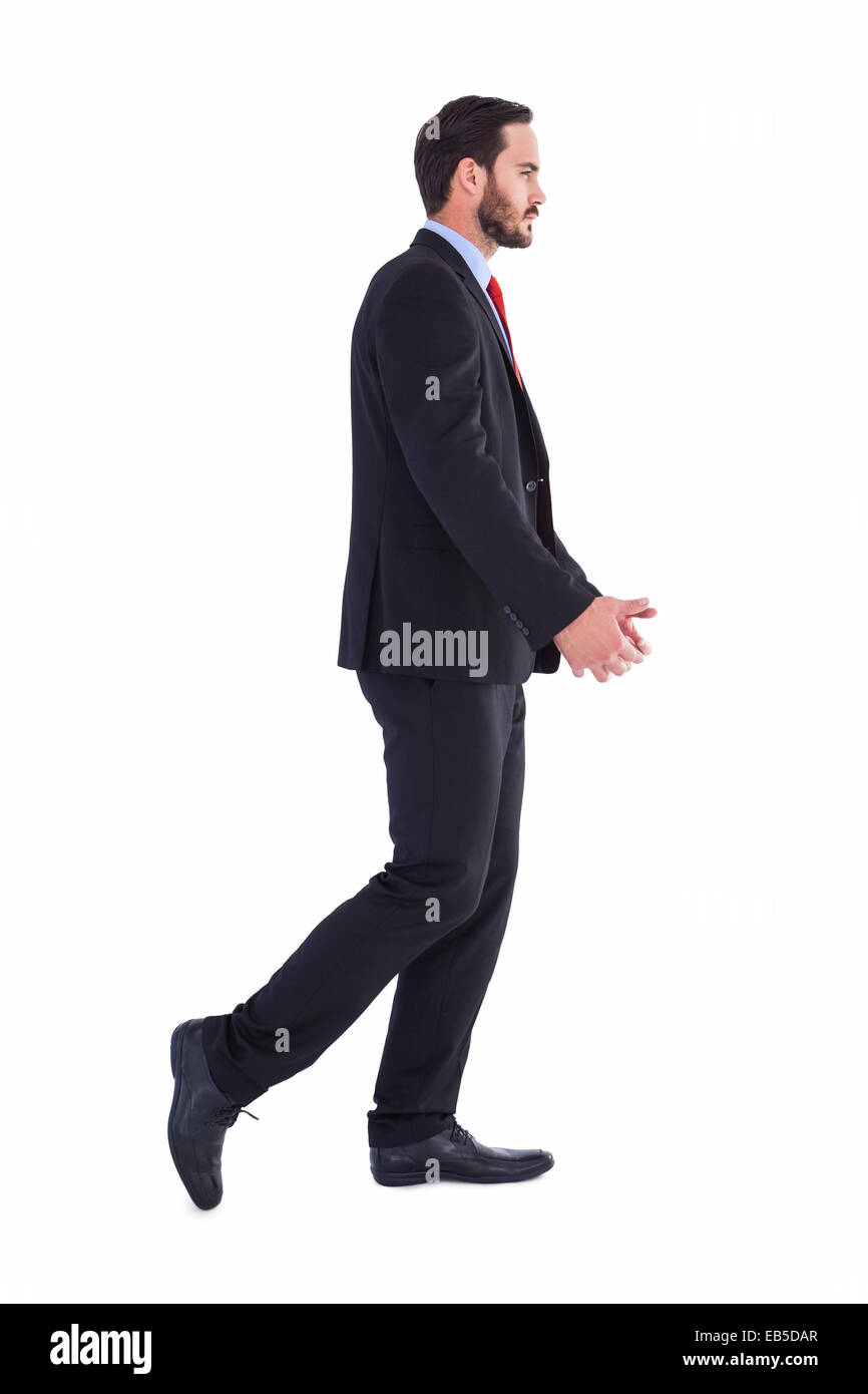 Handsome businessman in suit walking away Stock Photo - Alamy