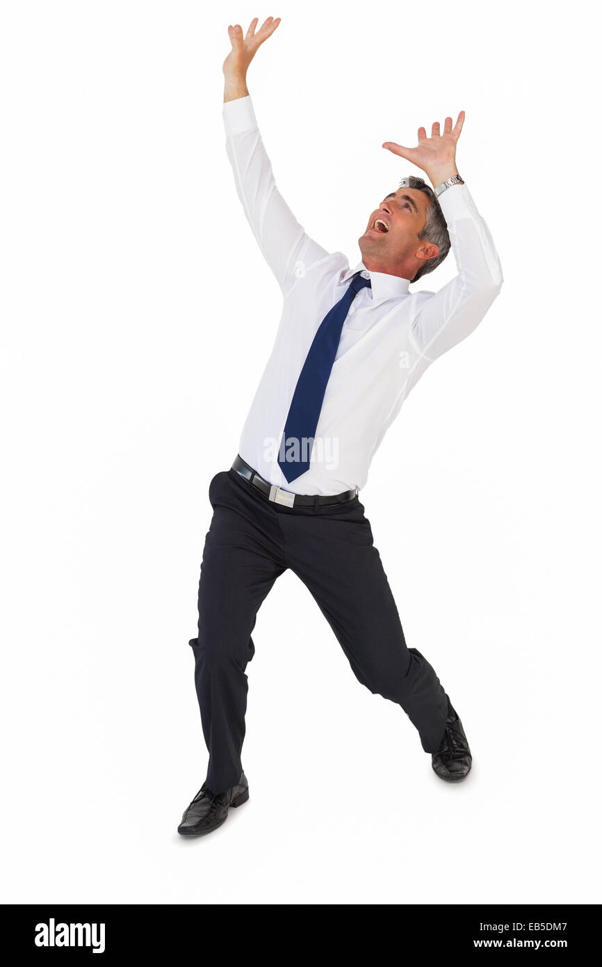 Businessman screaming with arms up Stock Photo - Alamy