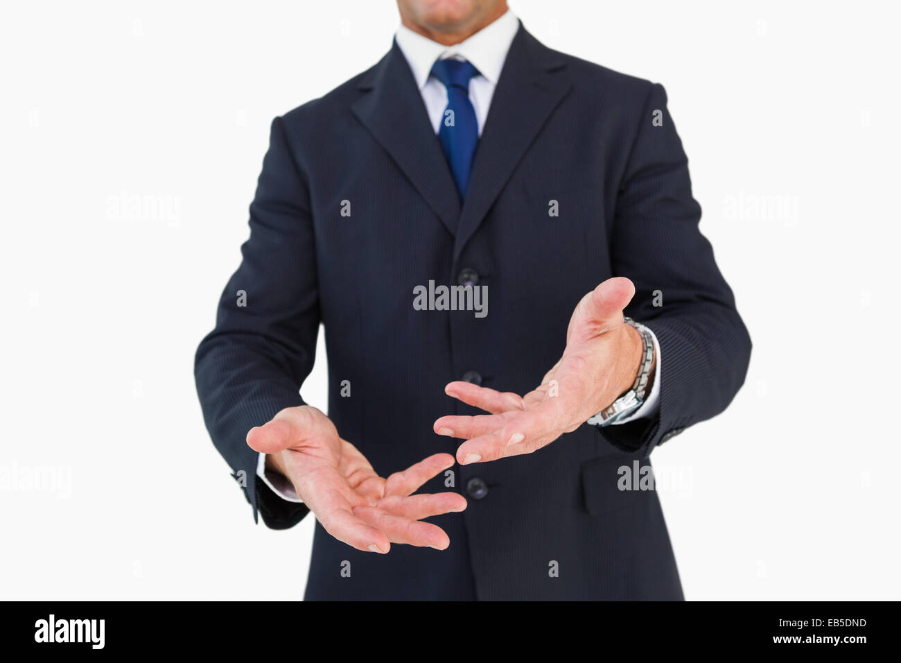 Mid section of a businessman with arms out Stock Photo - Alamy