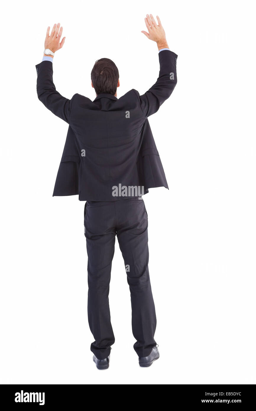 Businessman standing with hands up Stock Photo - Alamy
