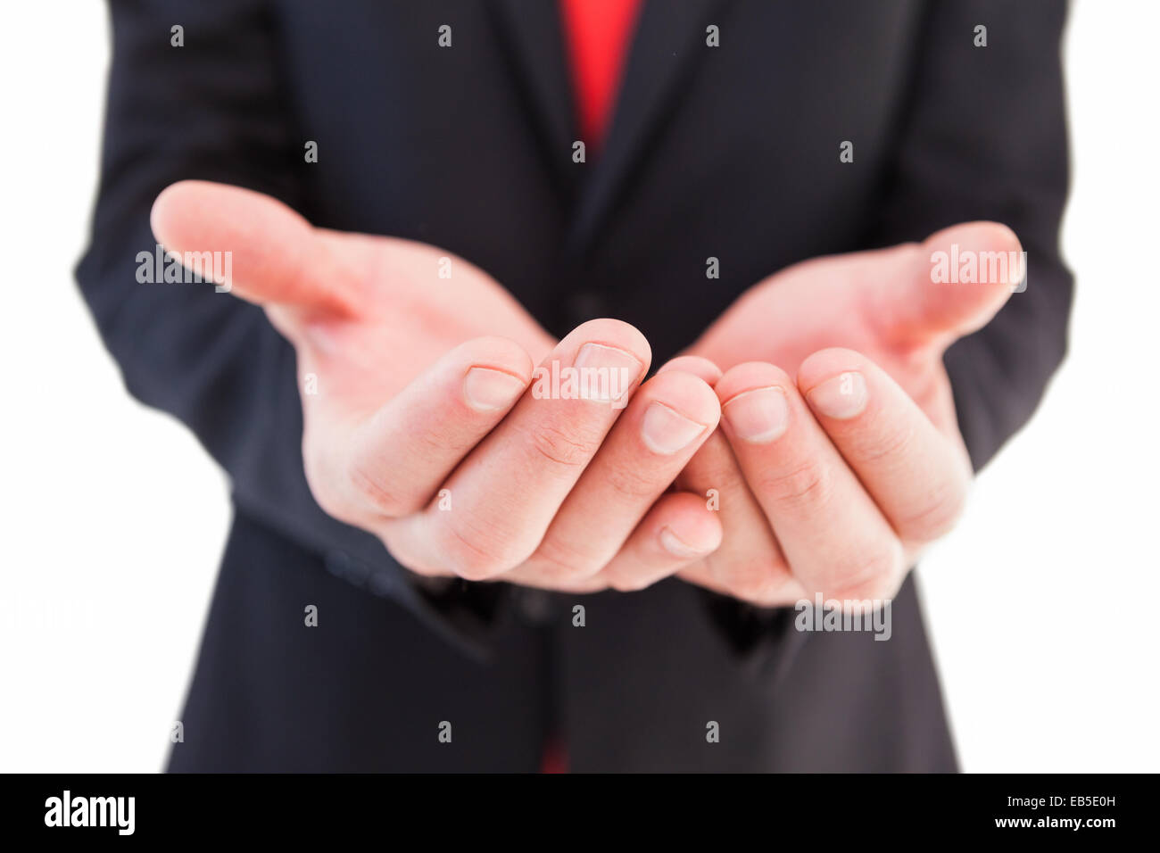 Businessman presenting with his hands Stock Photo - Alamy