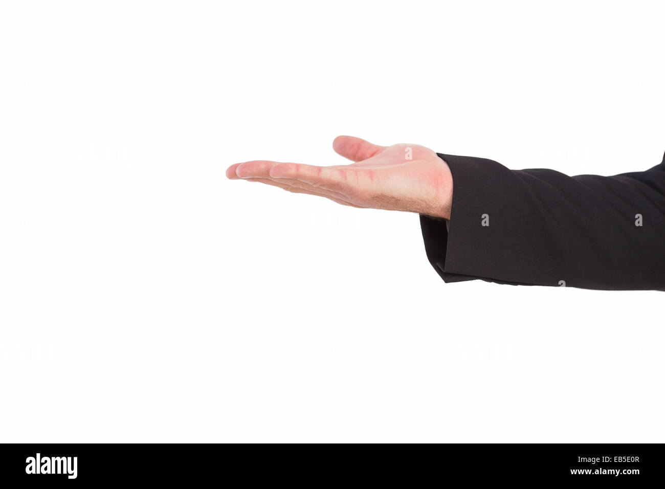 Businessman holding hand out in presentation Stock Photo - Alamy