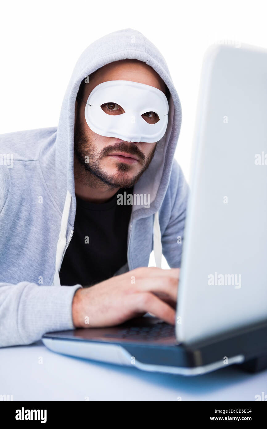 Cyber criminal wearing white mask hi-res stock photography and images ...