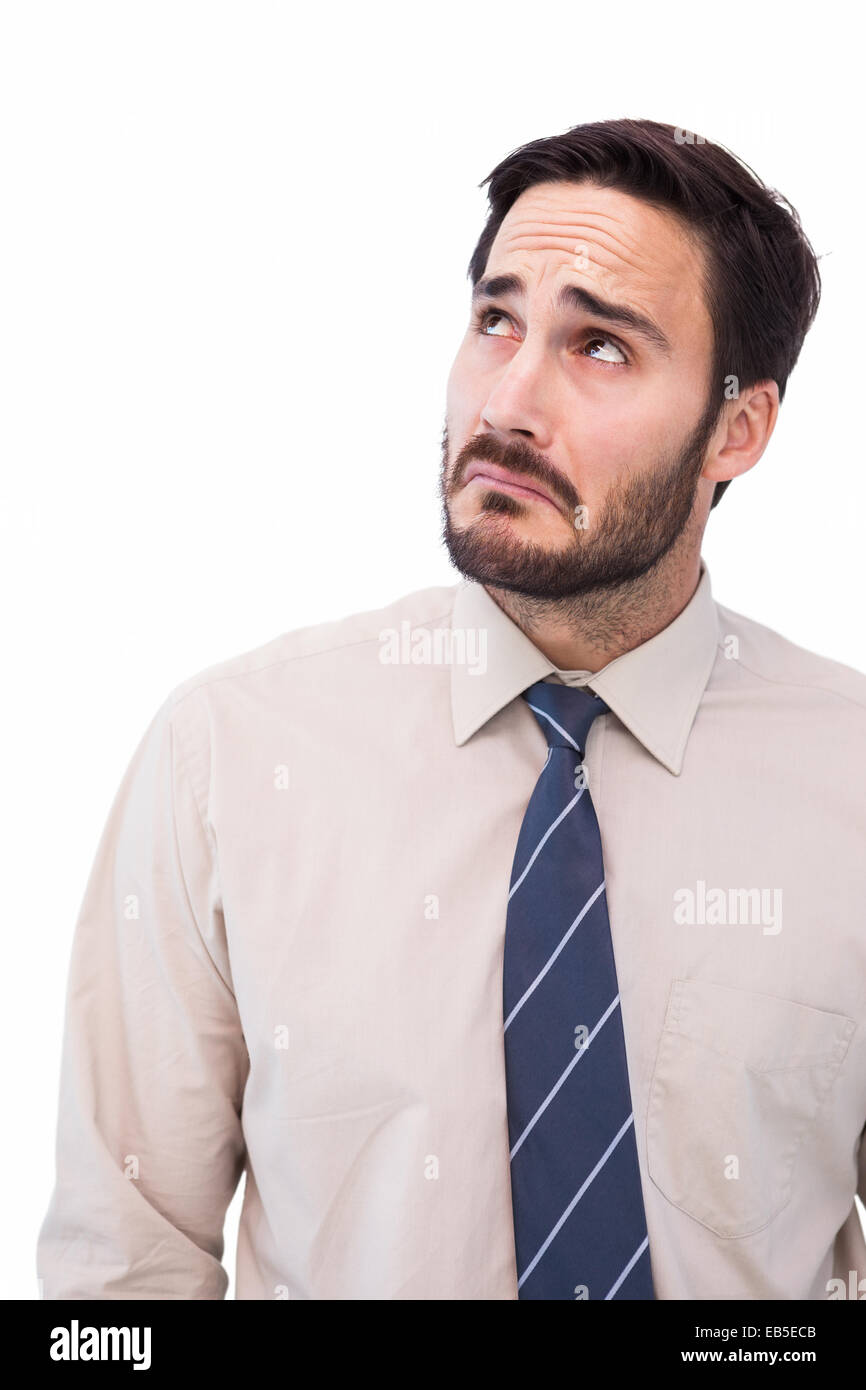 Portrait of a nervous businessman looking up Stock Photo - Alamy