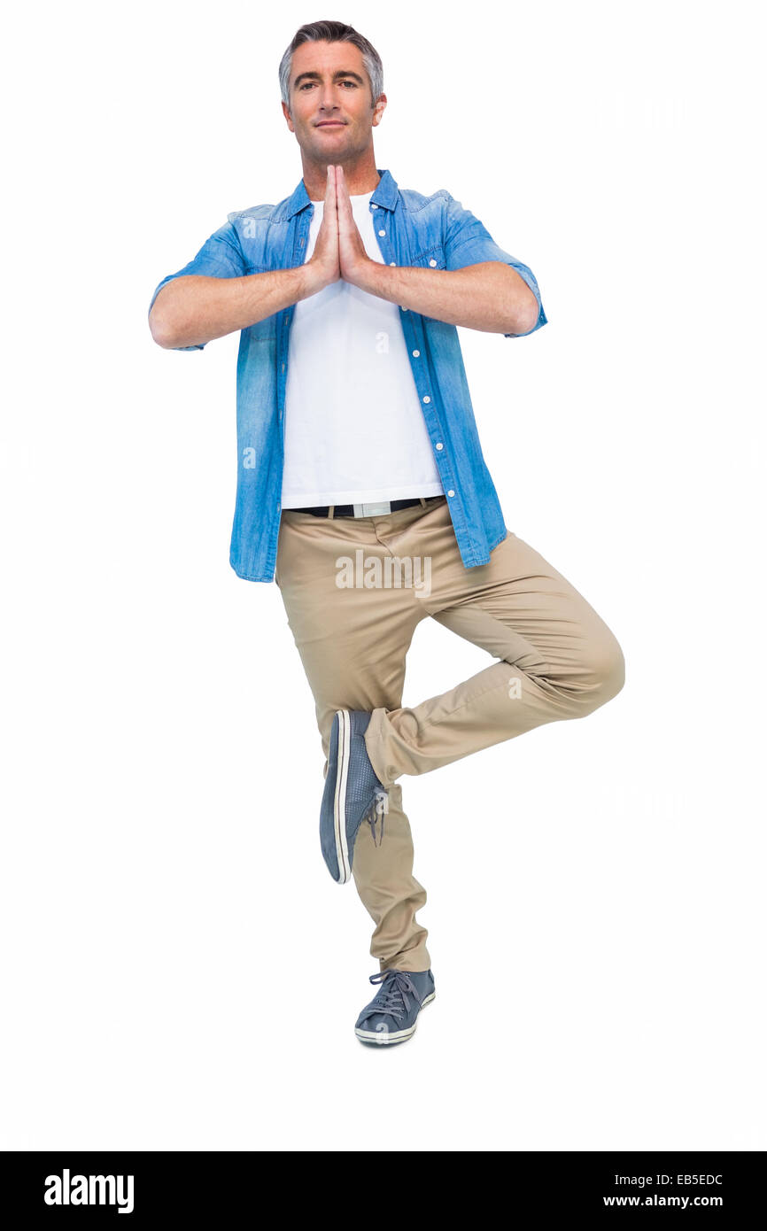 Man with grey hair in tree pose Stock Photo - Alamy