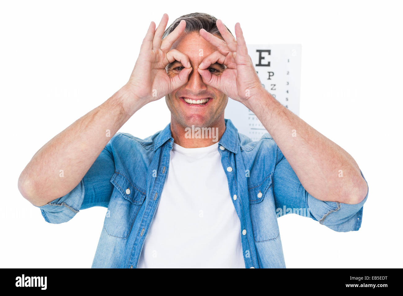 Fingers around eyes hi-res stock photography and images - Alamy