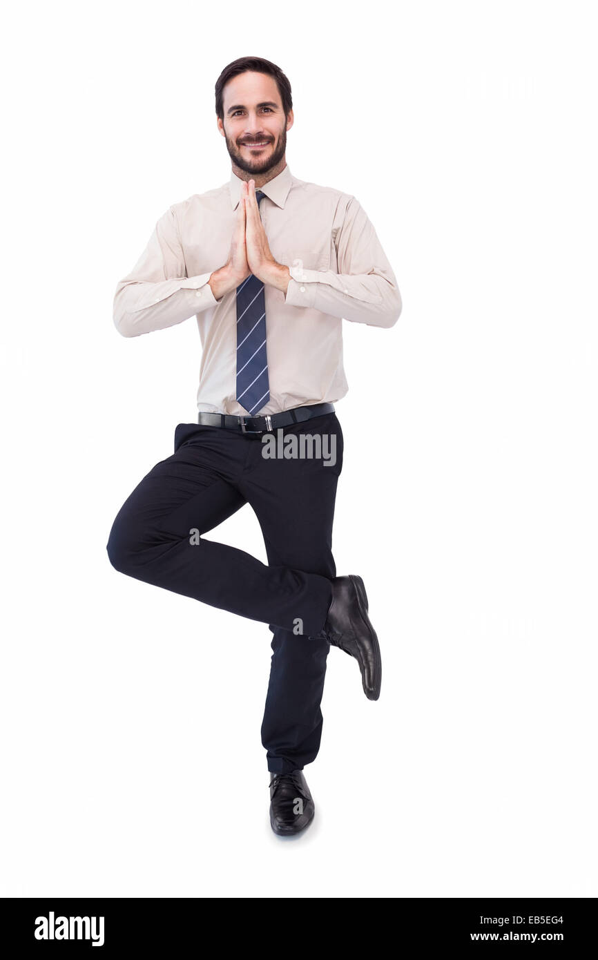 Smiling businessman standing in tree pose Stock Photo - Alamy