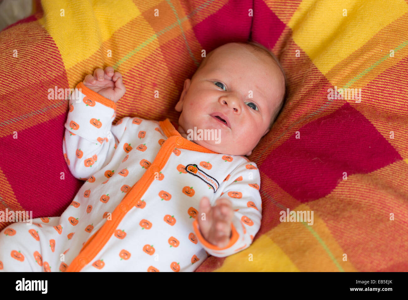 Adorable newborn baby crying alone Stock Photo - Alamy