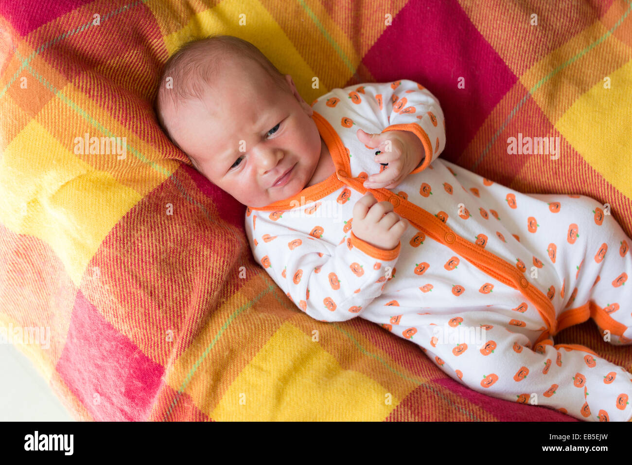 Adorable newborn baby crying alone Stock Photo - Alamy