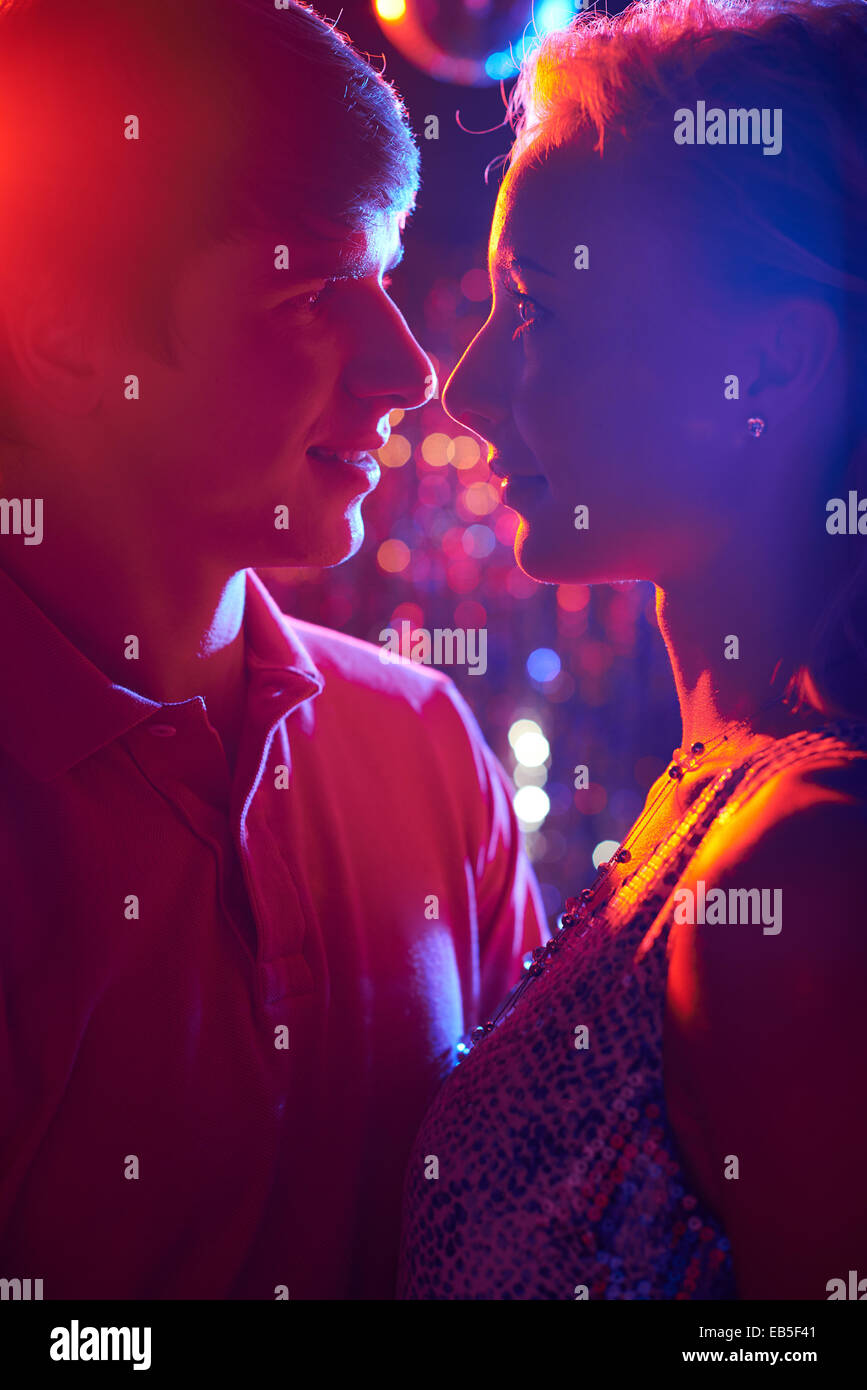 Couple in neon lights Stock Photo - Alamy